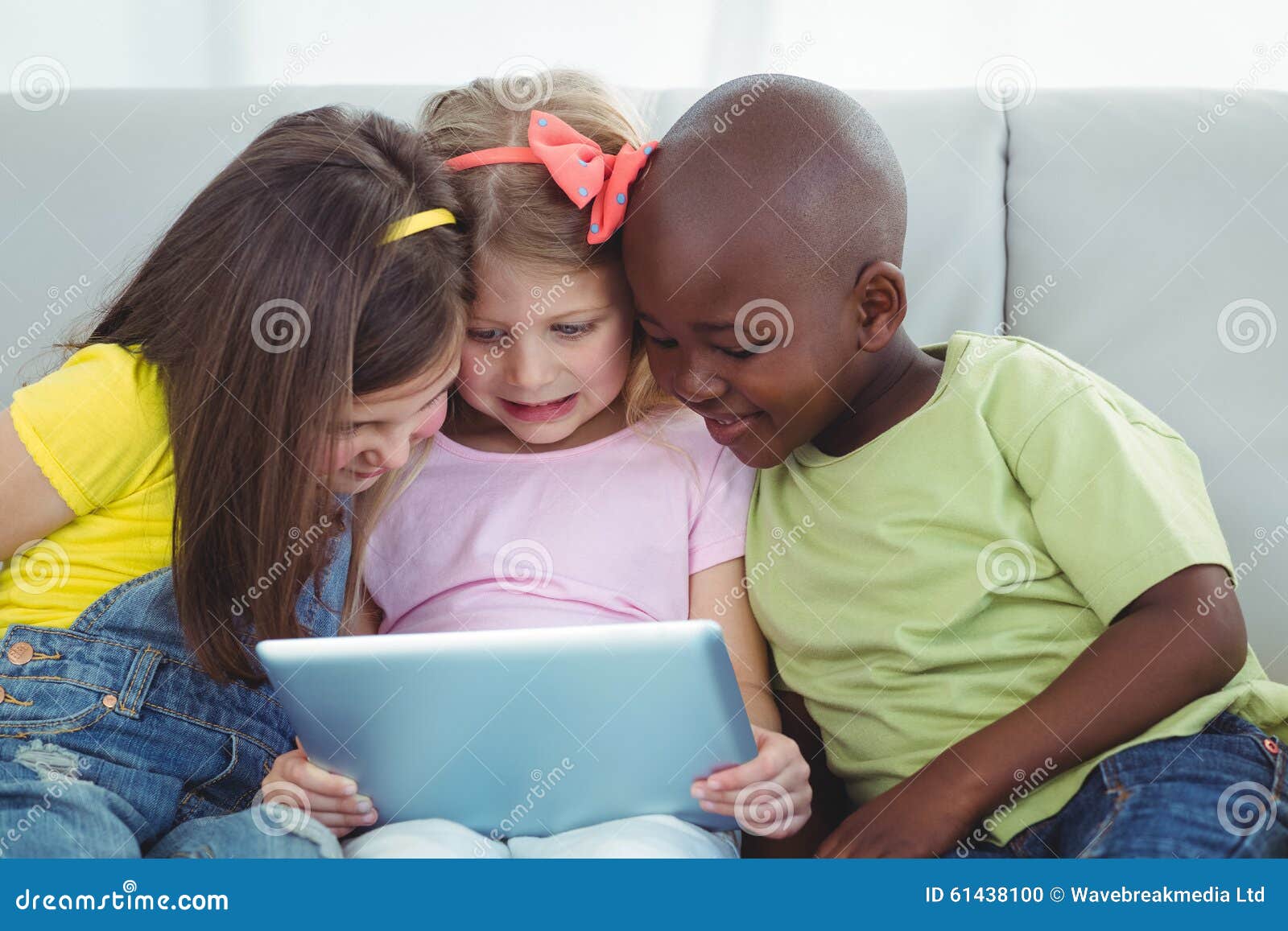 Happy Kids Sitting Together with a Tablet Stock Photo - Image of people ...