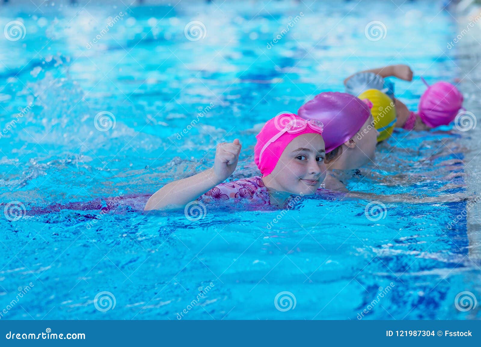 Happy Kids at the Swimming Pool. Young and Successful Swimmers Pose ...