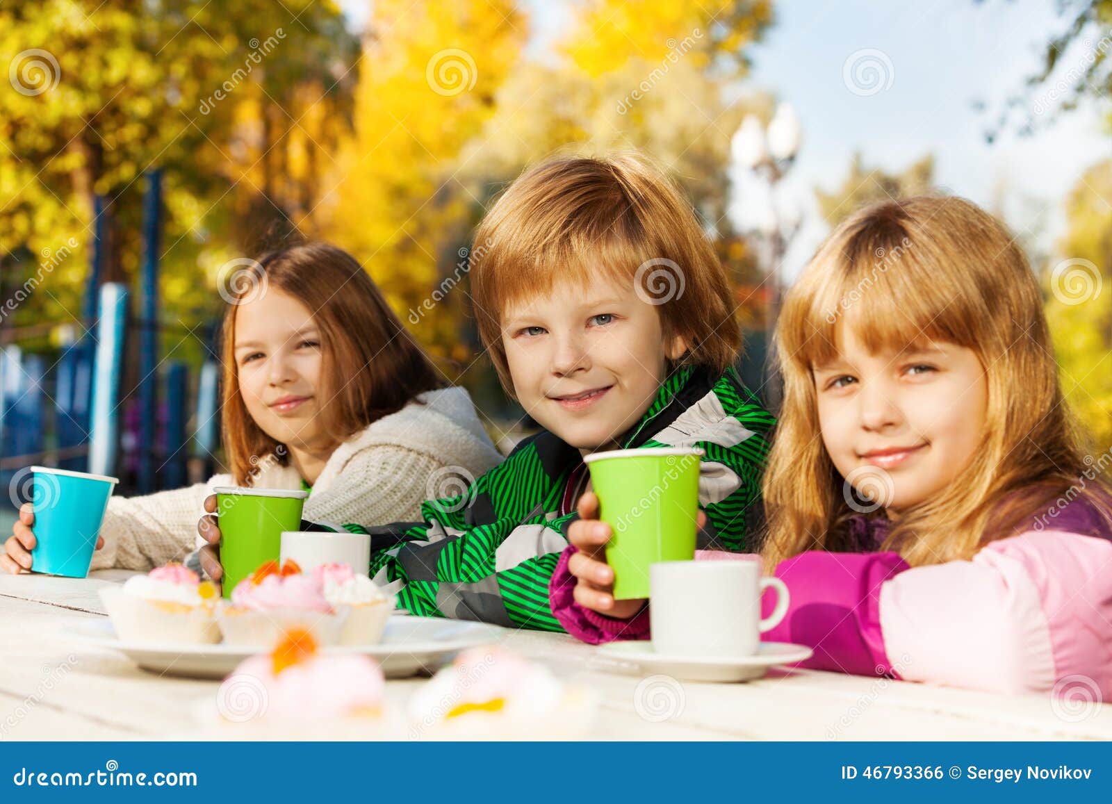 Happy Kids with Tea Cups Sitting Outside Stock Photo - Image of ...