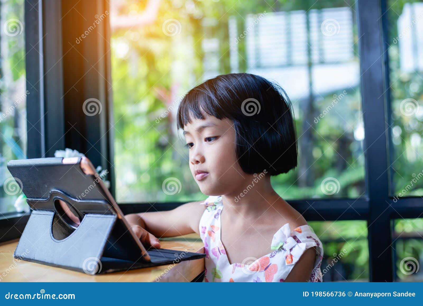 Happy Kids Using a Laptop Computer at Home Stock Photo - Image of asian ...