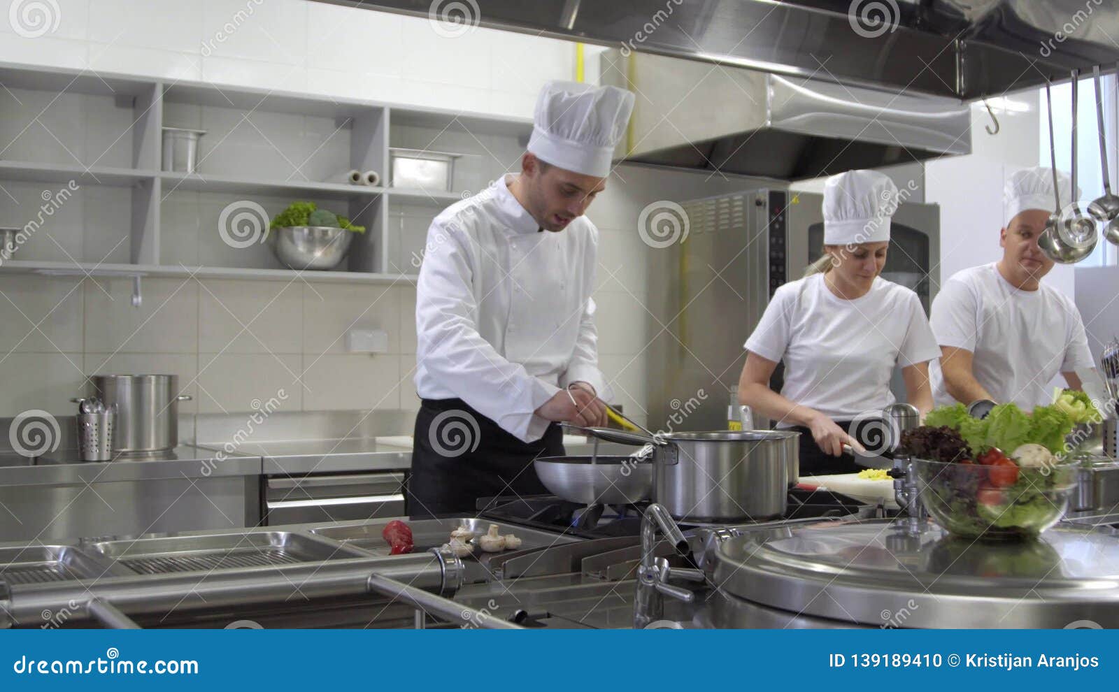 Happy Kitchen Crew with Chef Singing and Dancing while Cooking Stock ...