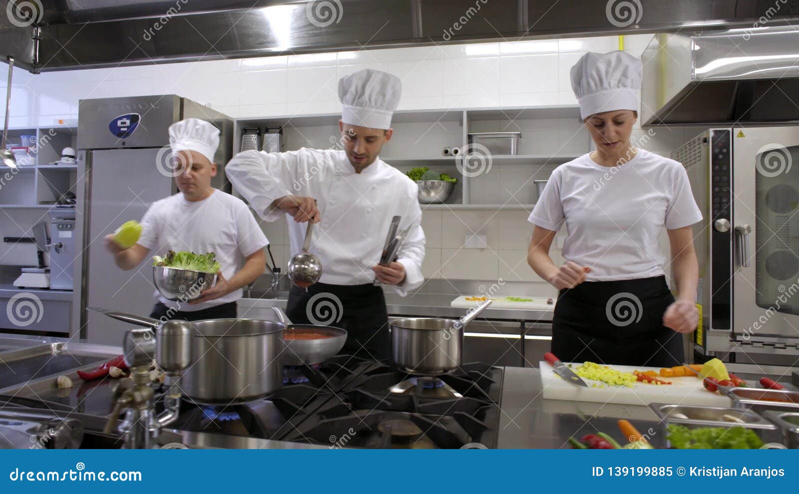Happy Kitchen Crew with Chef Singing and Dancing while Cooking Stock ...