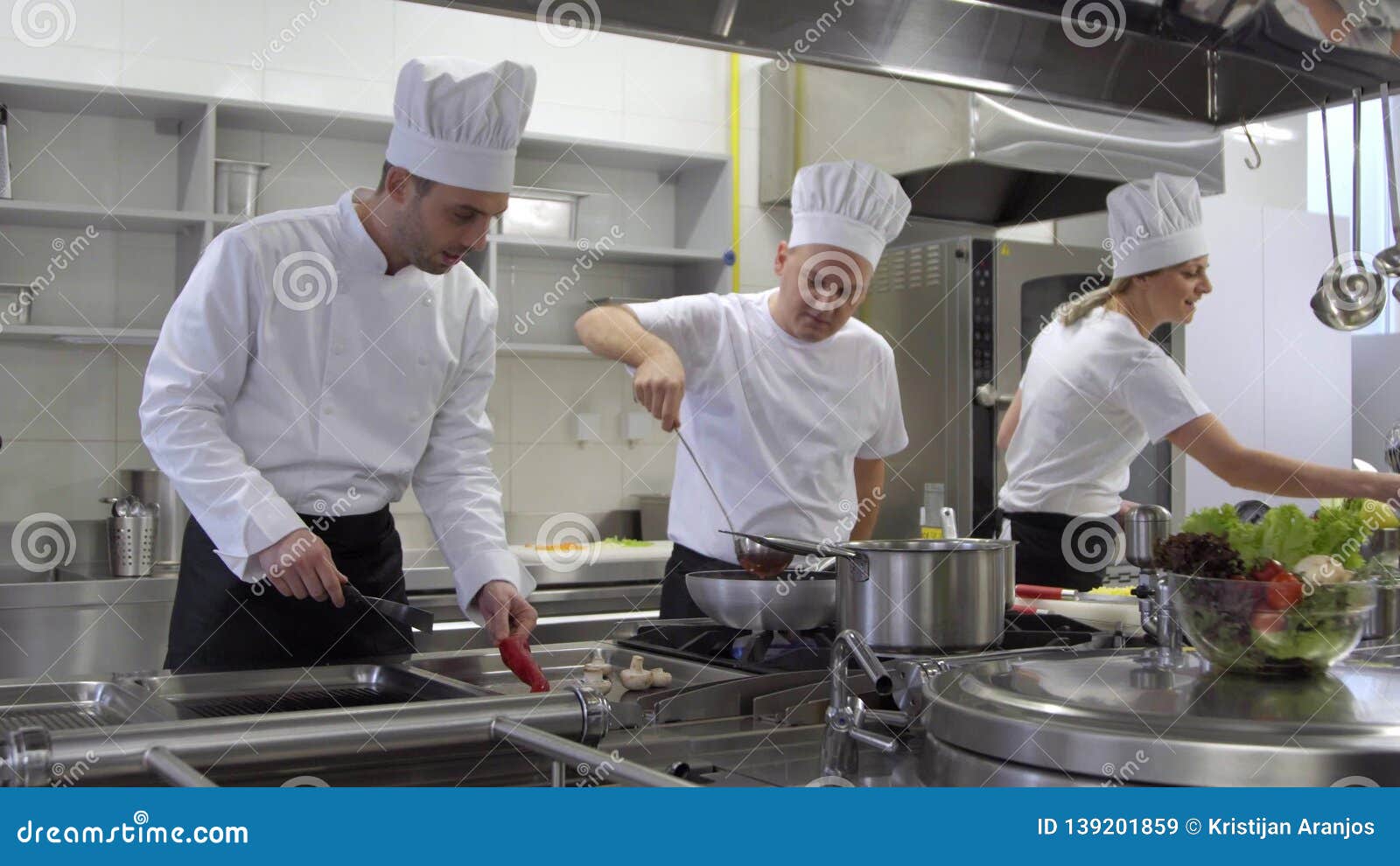 Happy Kitchen Crew with Chef Singing and Dancing while Cooking Stock ...