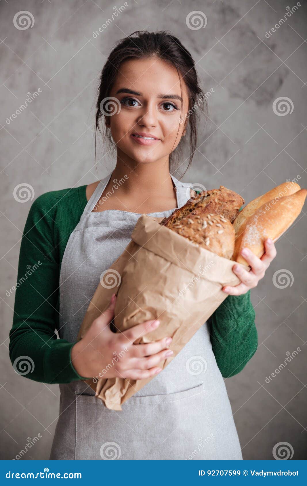 Happy Lady Baker Standing and Holding Bread. Stock Image - Image of ...