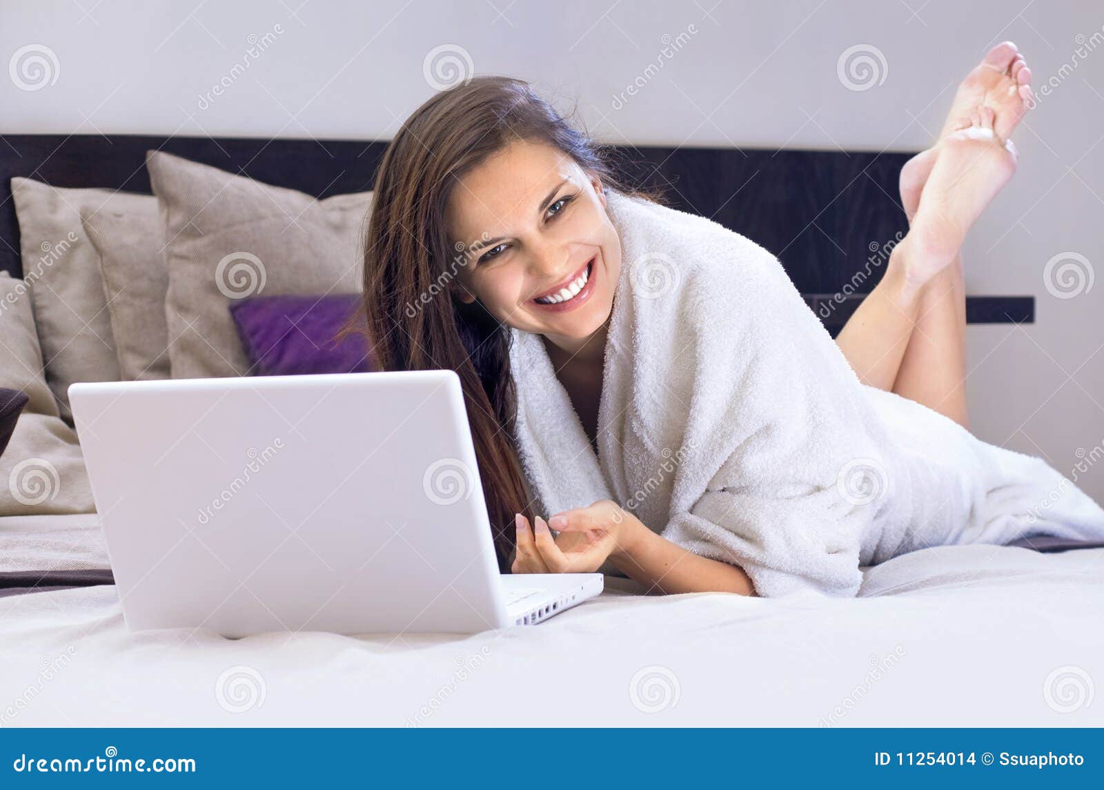 Happy Lady on the Bed with Laptop Stock Photo - Image of happy, cute ...