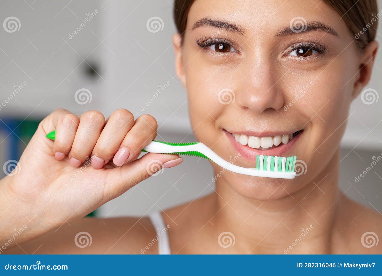 Happy Lady Brushing Teeth with Toothbrush Standing in Bathroom Stock ...