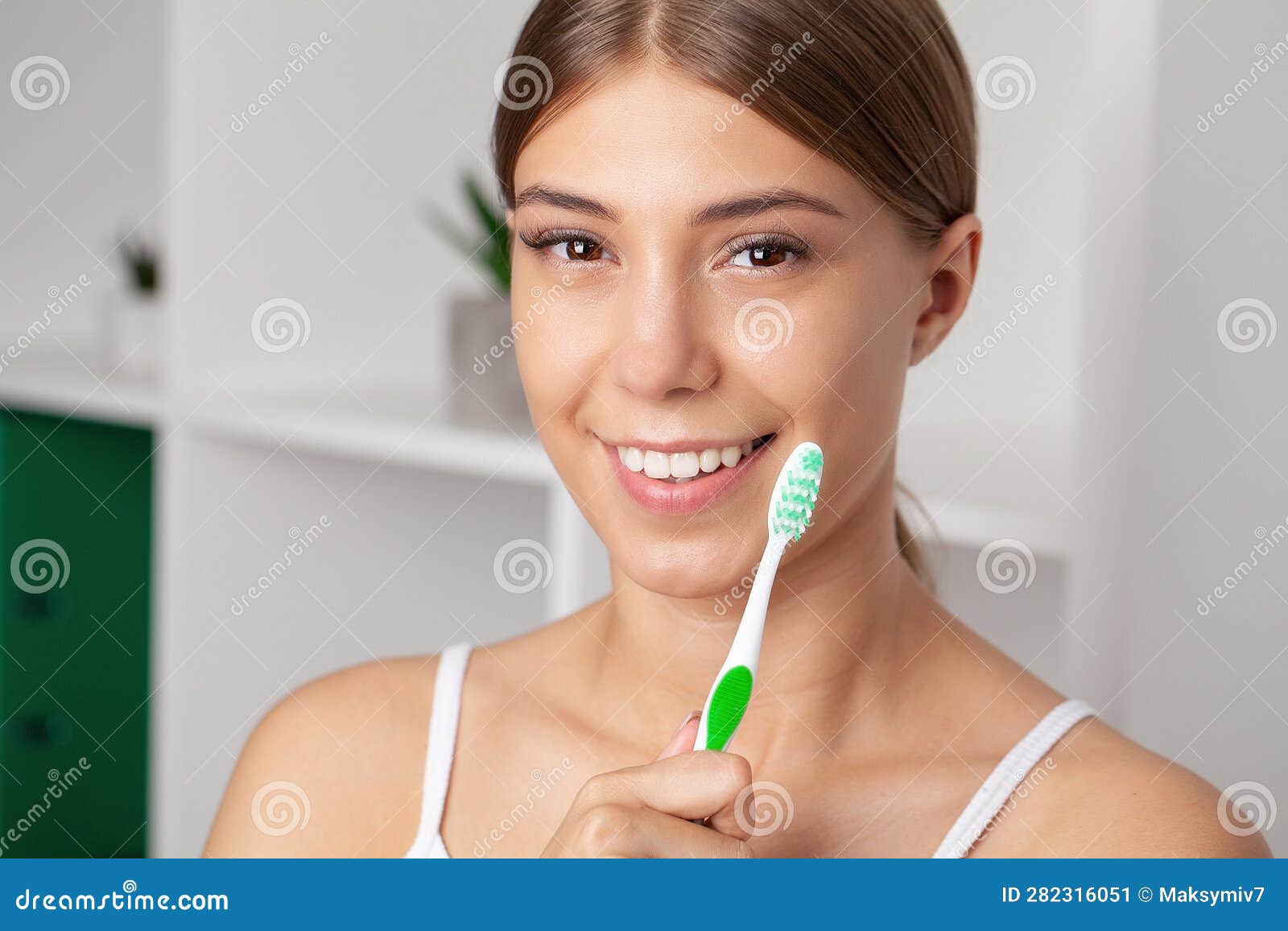 Happy Lady Brushing Teeth with Toothbrush Standing in Bathroom Stock ...