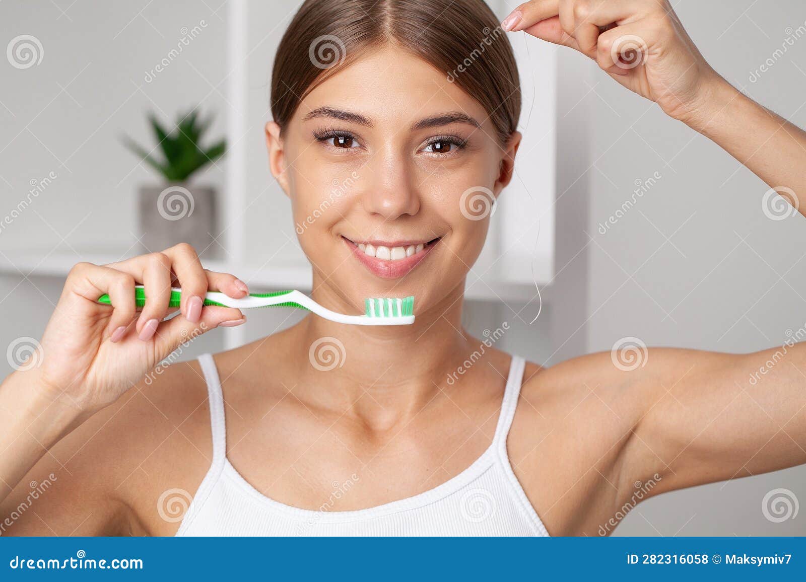 Happy Lady Brushing Teeth with Toothbrush Standing in Bathroom Stock ...