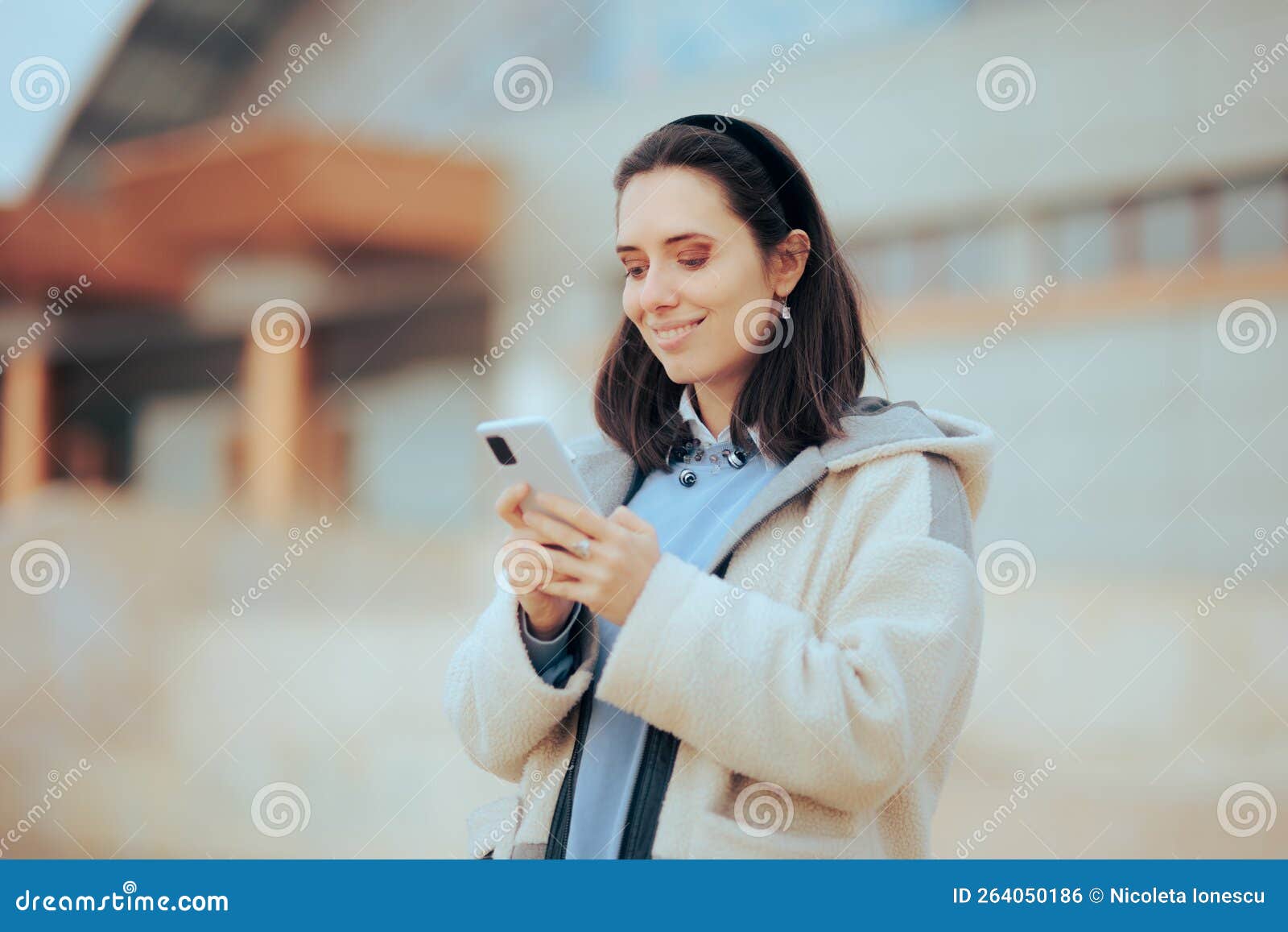 Happy Woman Reading a Text Message on Her Phone Stock Photo - Image of ...