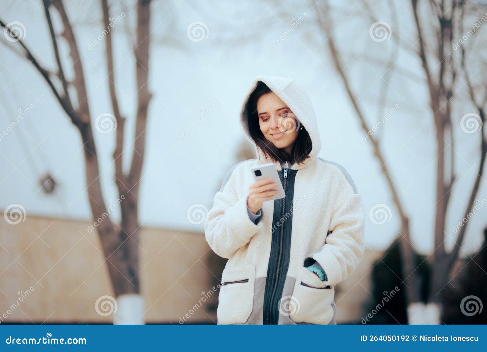 Happy Woman Reading a Text Message on Her Phone Stock Photo - Image of ...