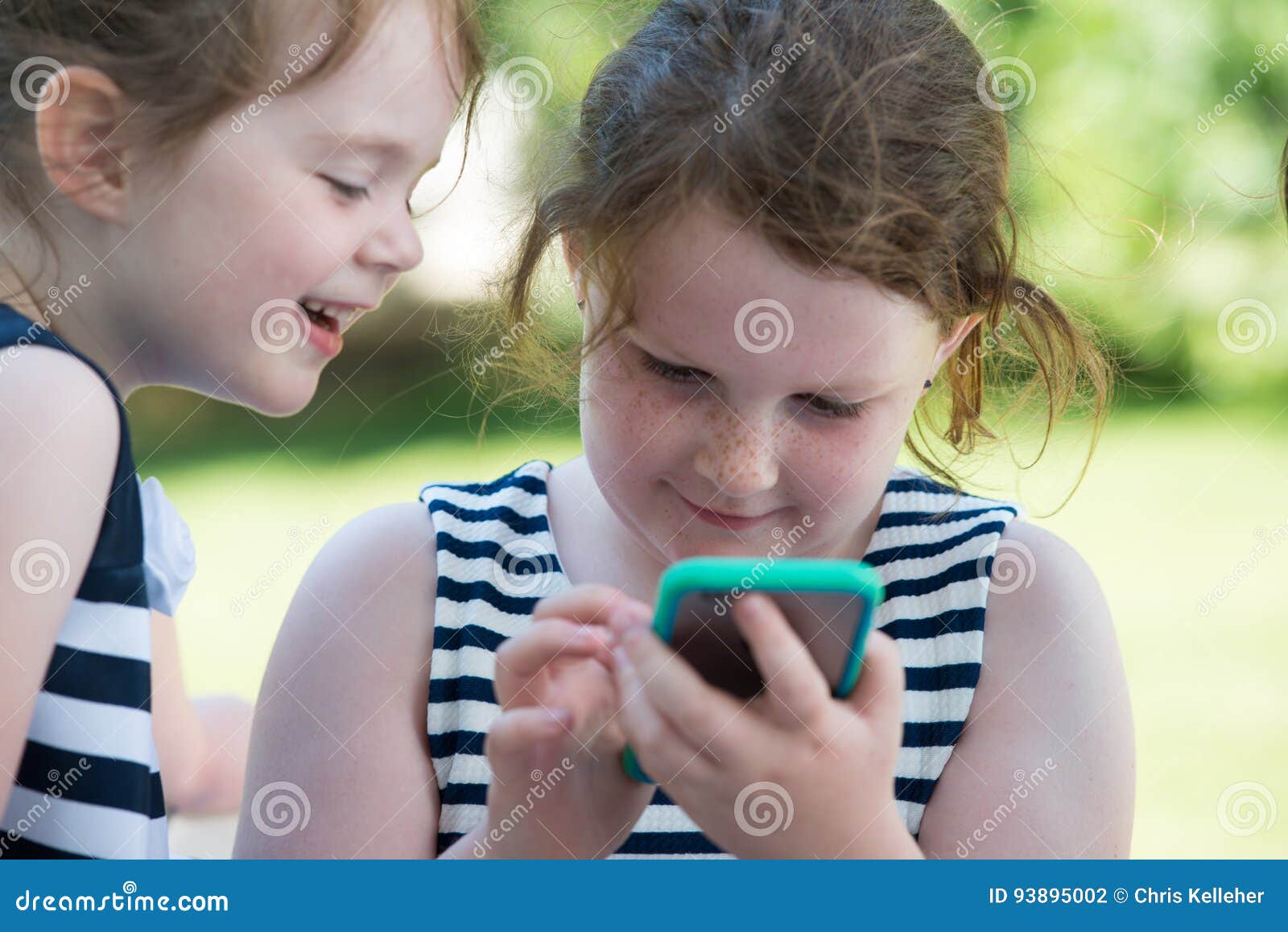 Happy Laughing Children Playing with Smartphone Outside Stock Photo ...