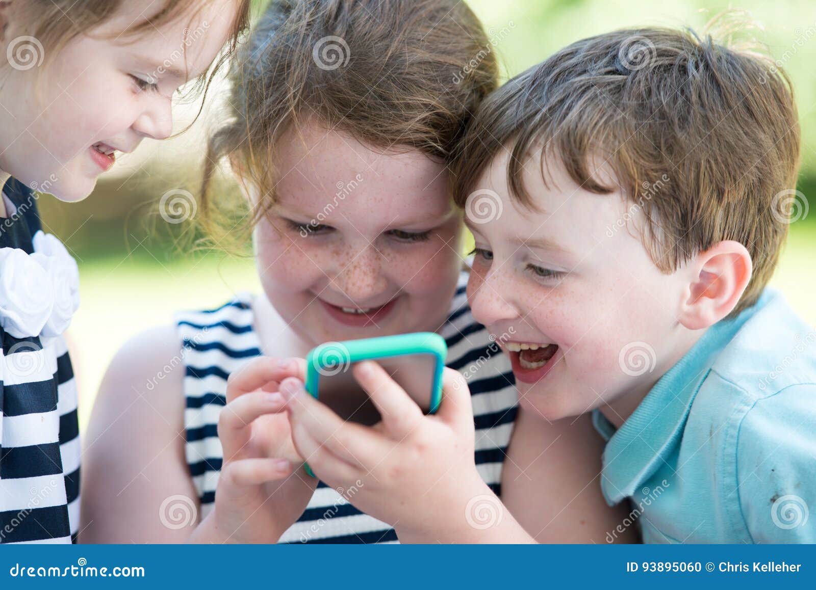 Happy Laughing Children Playing with Smartphone Outside Stock Photo ...