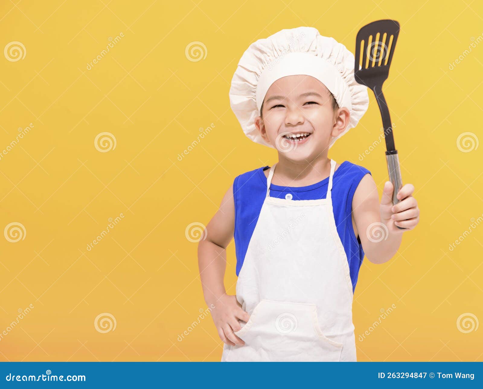 Happy Little Boy in Chef Uniform on Yellow Background Stock Image ...