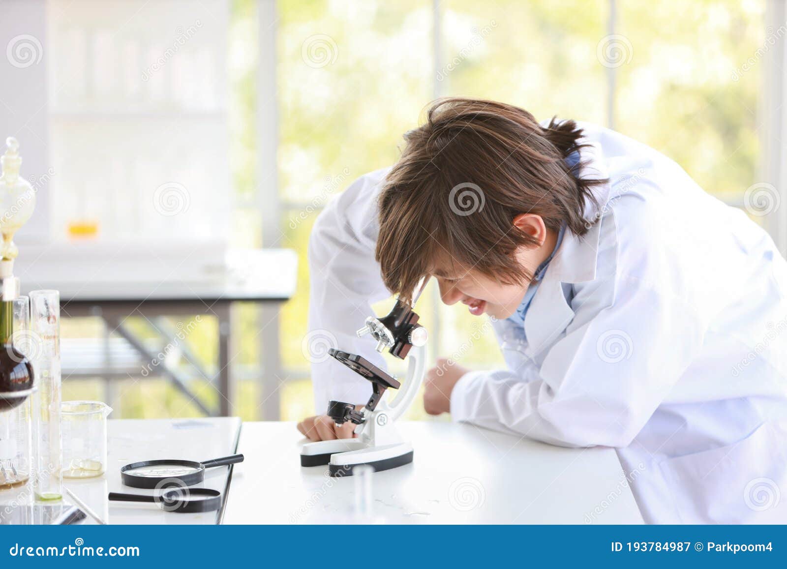 Happy Little Boy Making Science Experiments with Microscope Education ...