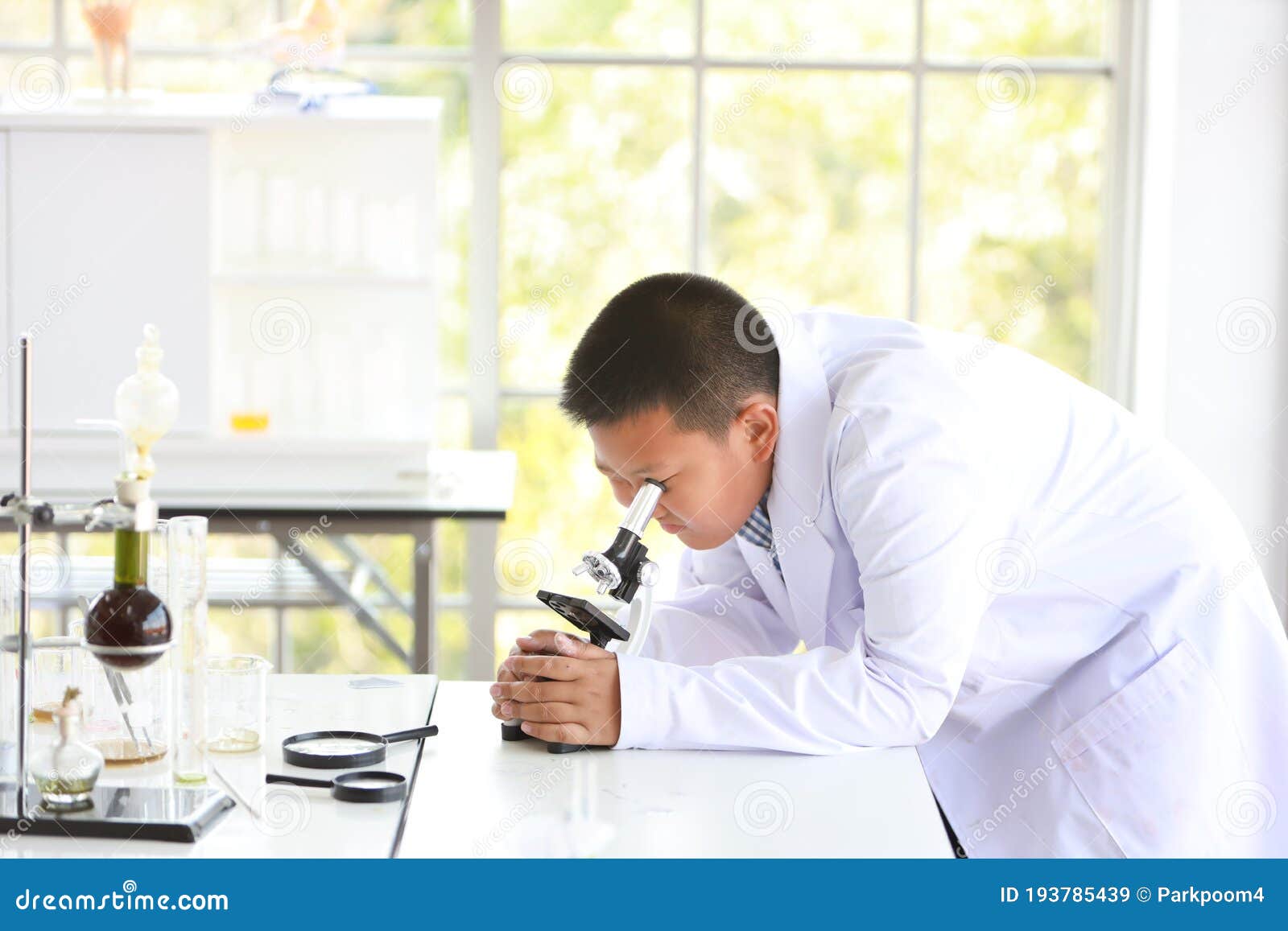 Happy Little Boy Making Science Experiments with Microscope Education ...