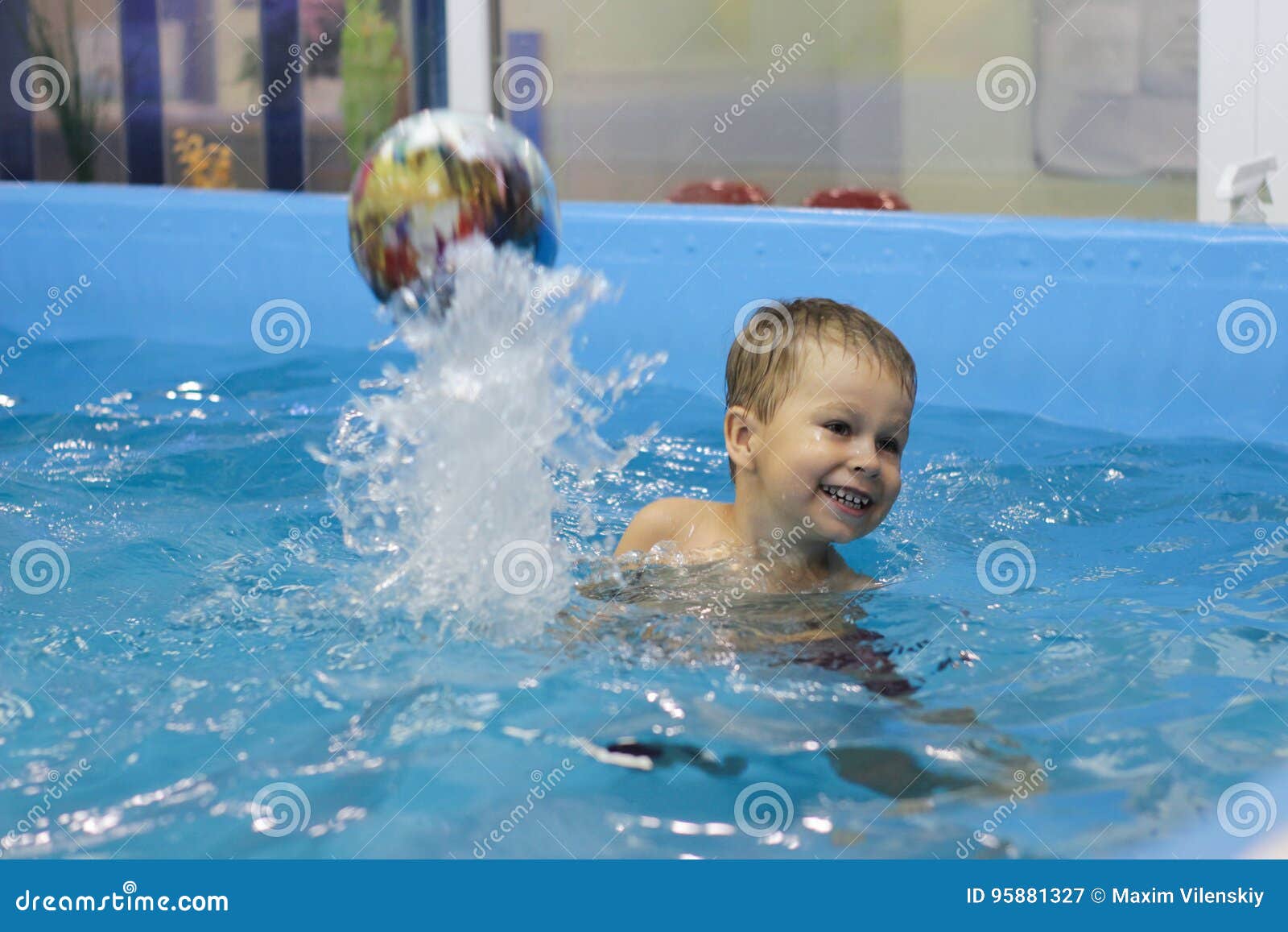 Happy Little Boy Playing with Ball in the Pool Stock Image - Image of ...