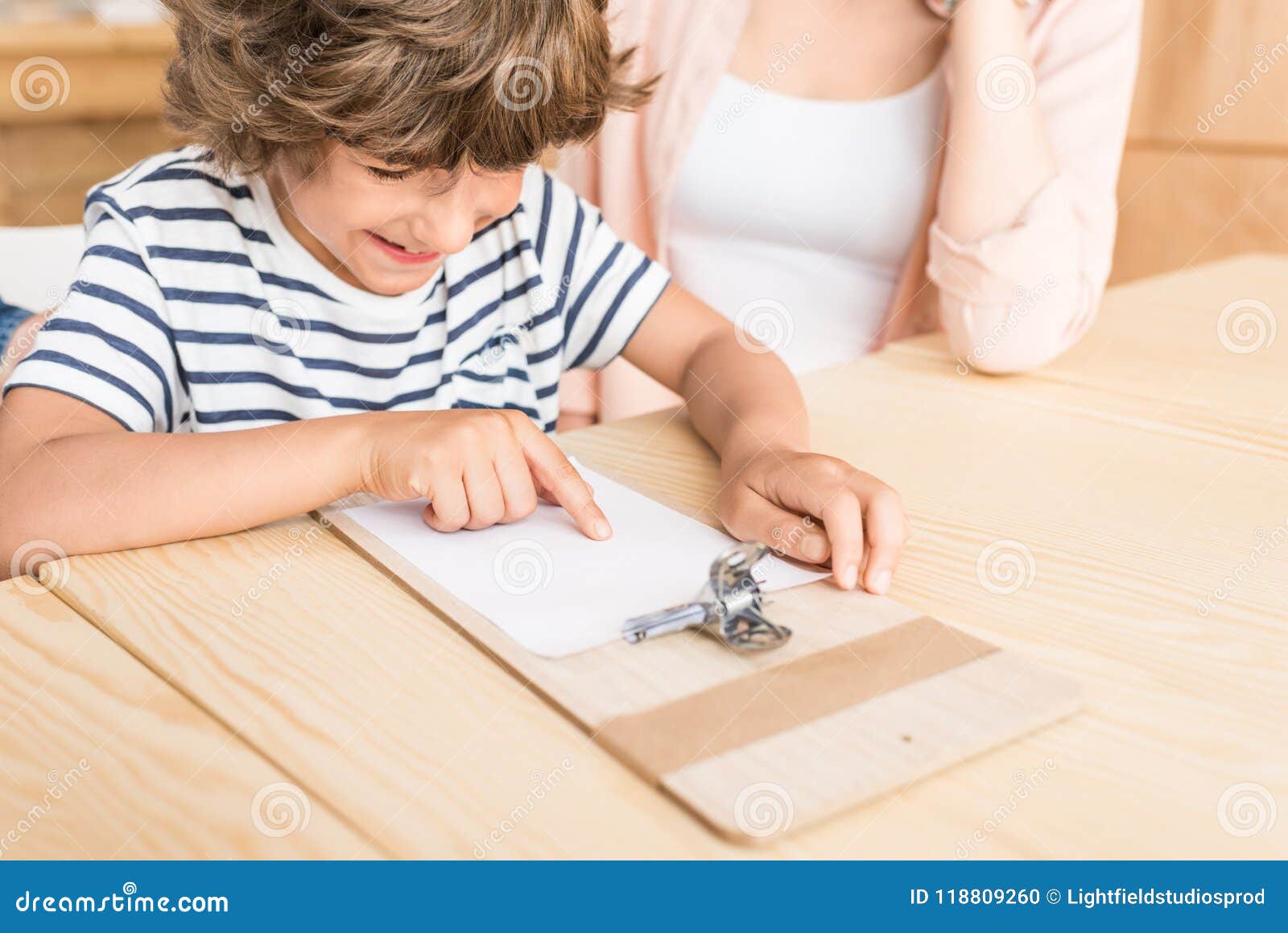 Happy Little Boy Pointing at Blank Paper Stock Photo - Image of ...