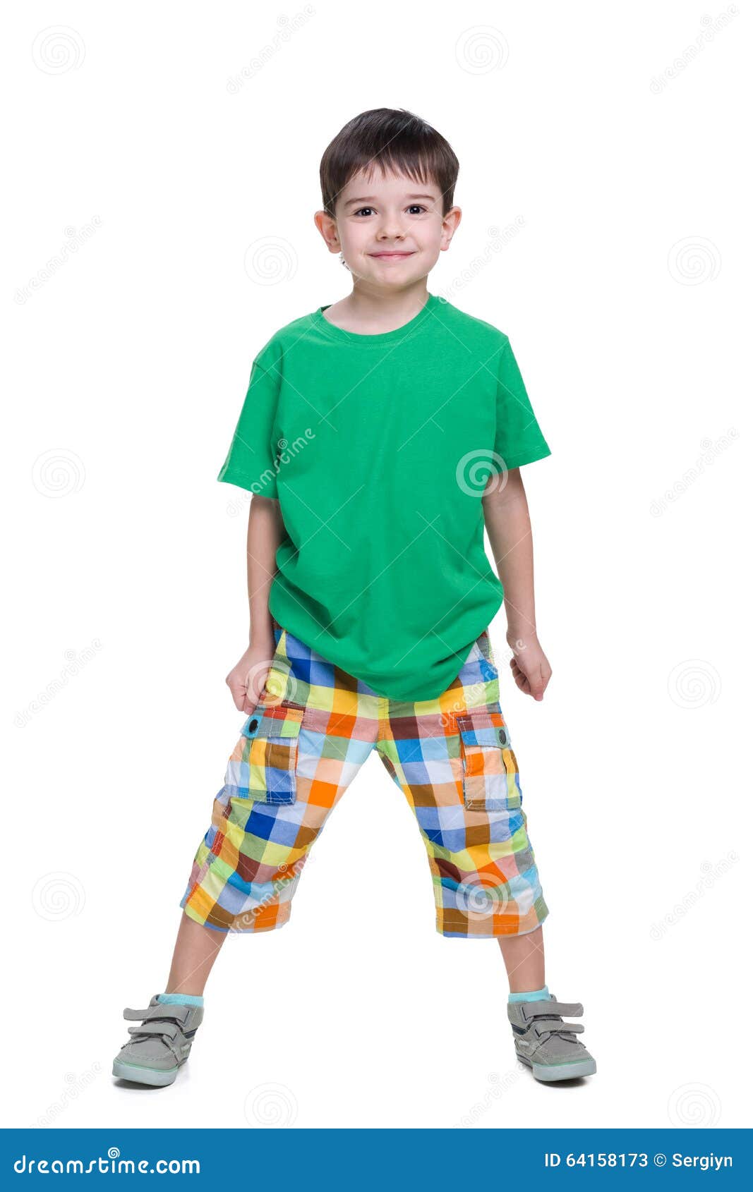 Happy little boy stands stock image. Image of fashion - 64158173