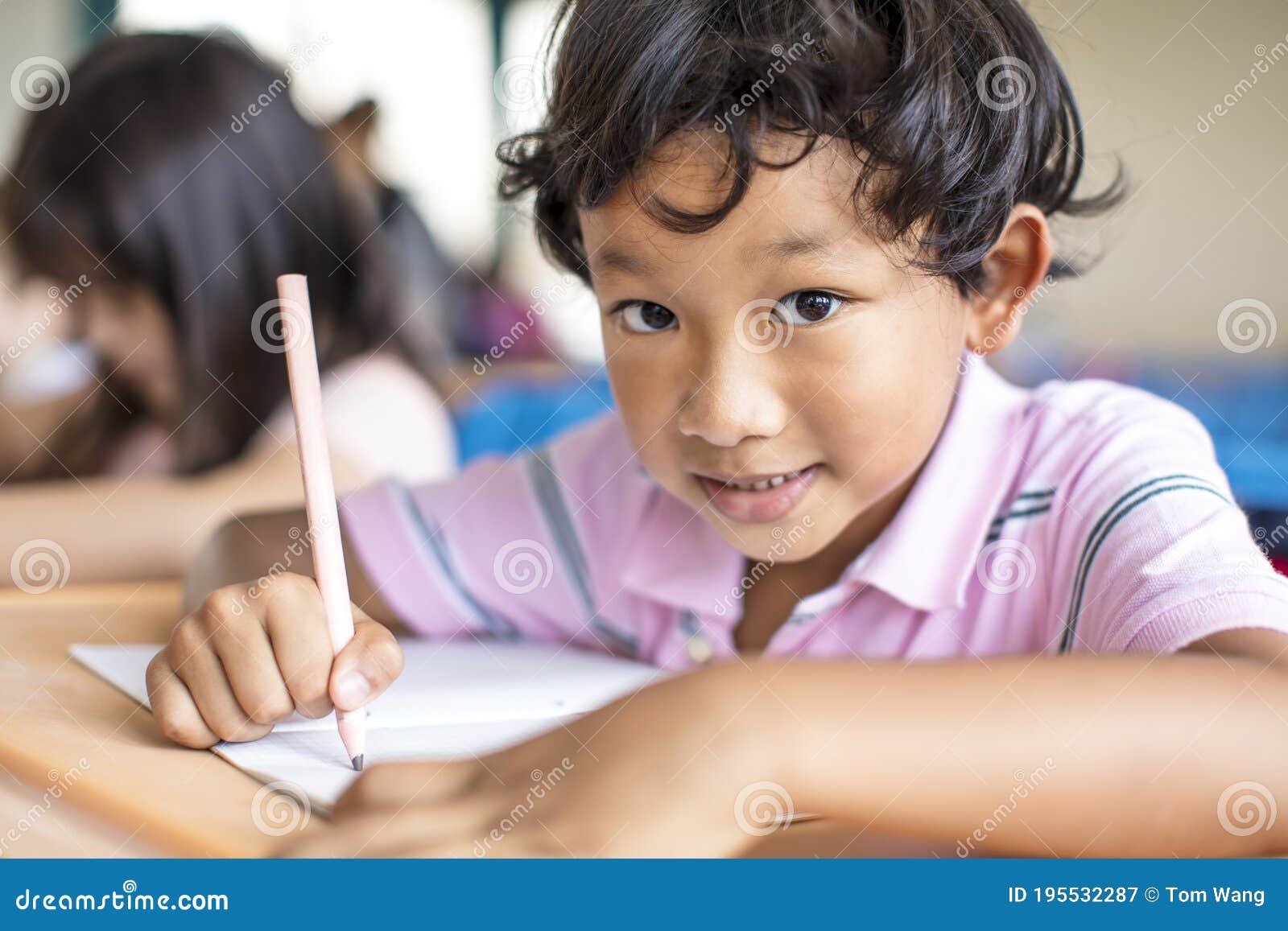 Happy Little Boy Studying in the Classroom Stock Image - Image of ...
