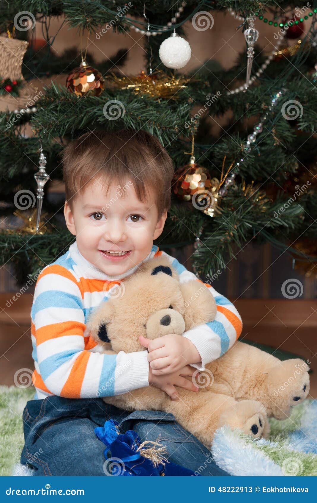 Happy Little Boy with a Teddy Bear in a Christmas Tree (3 Years Stock ...