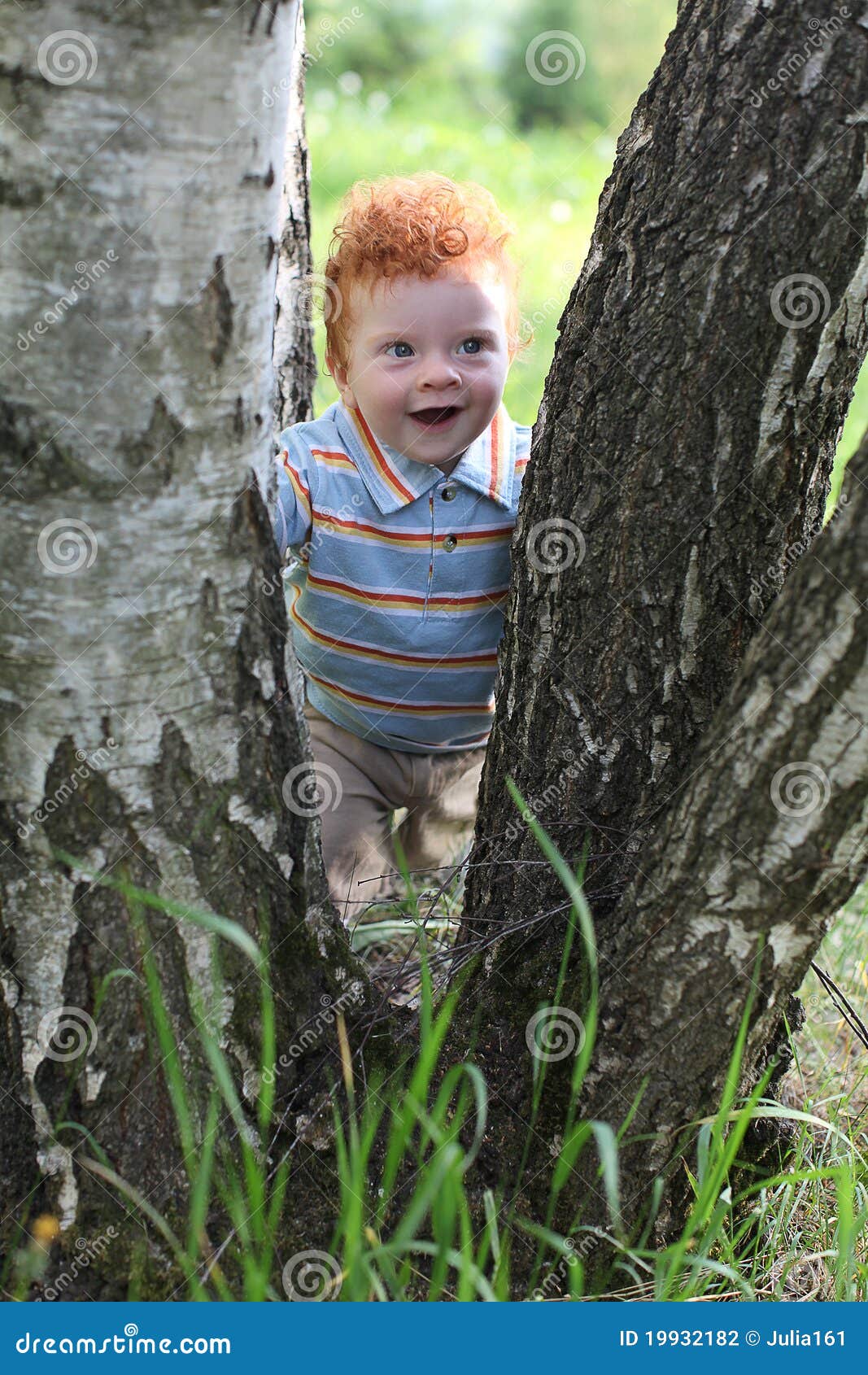 Happy Little Boy Trying To Walk by Trees Stock Photo - Image of hair ...