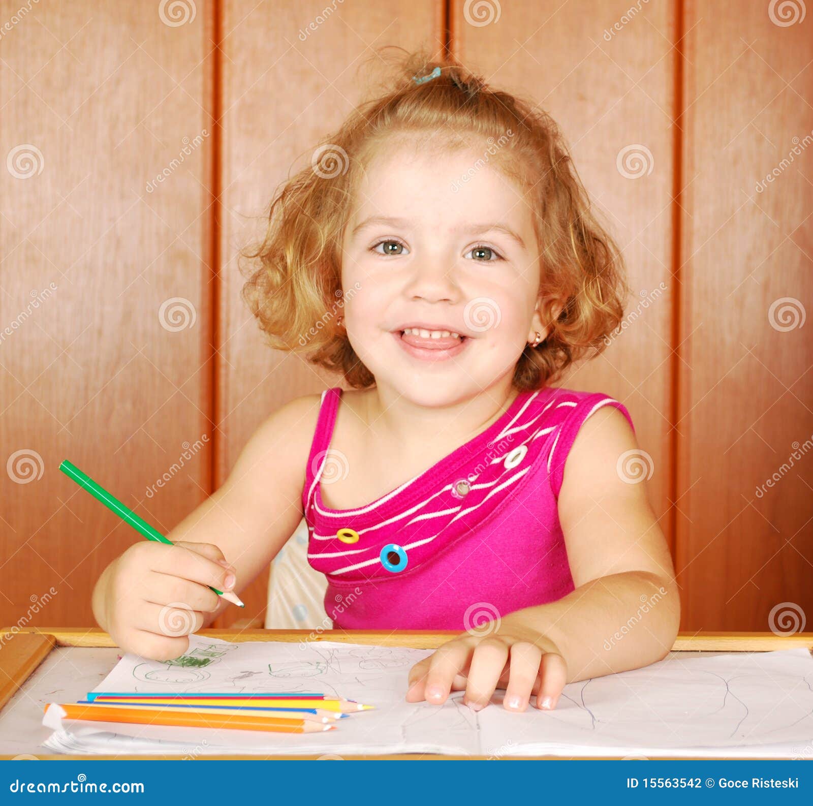 Happy little girl drawing stock photo. Image of cute - 15563542