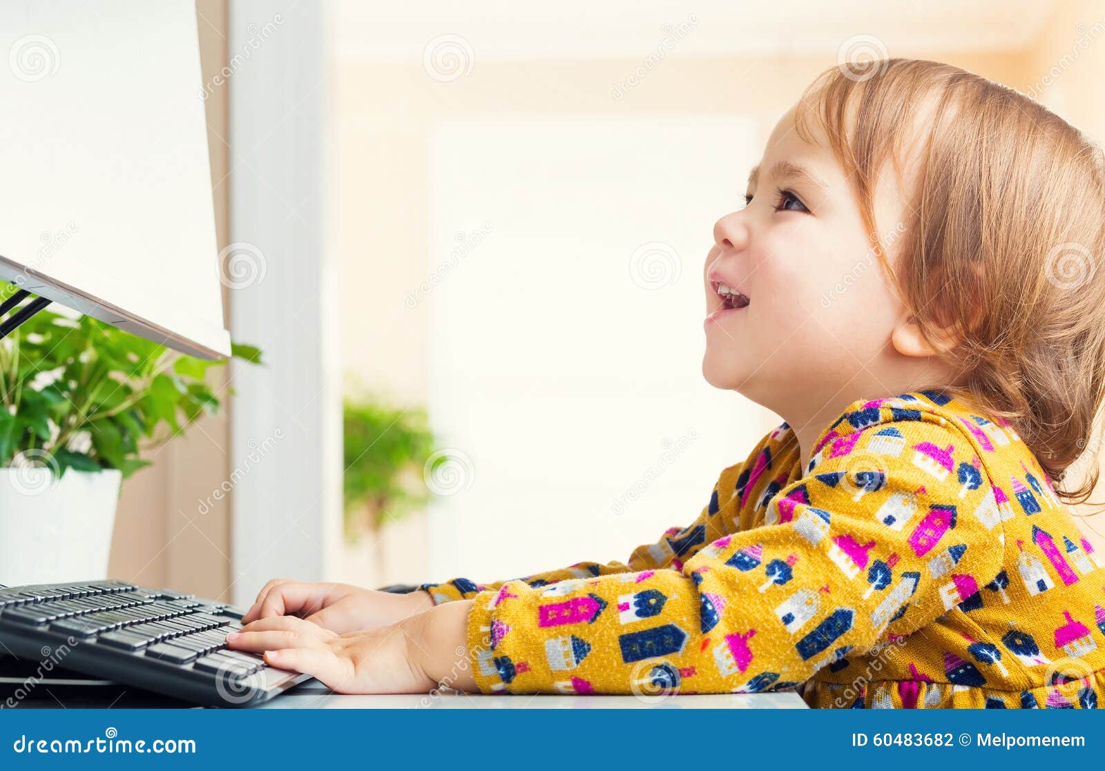 Happy Little Girl Having Fun Using Her Computer Stock Photo - Image of ...