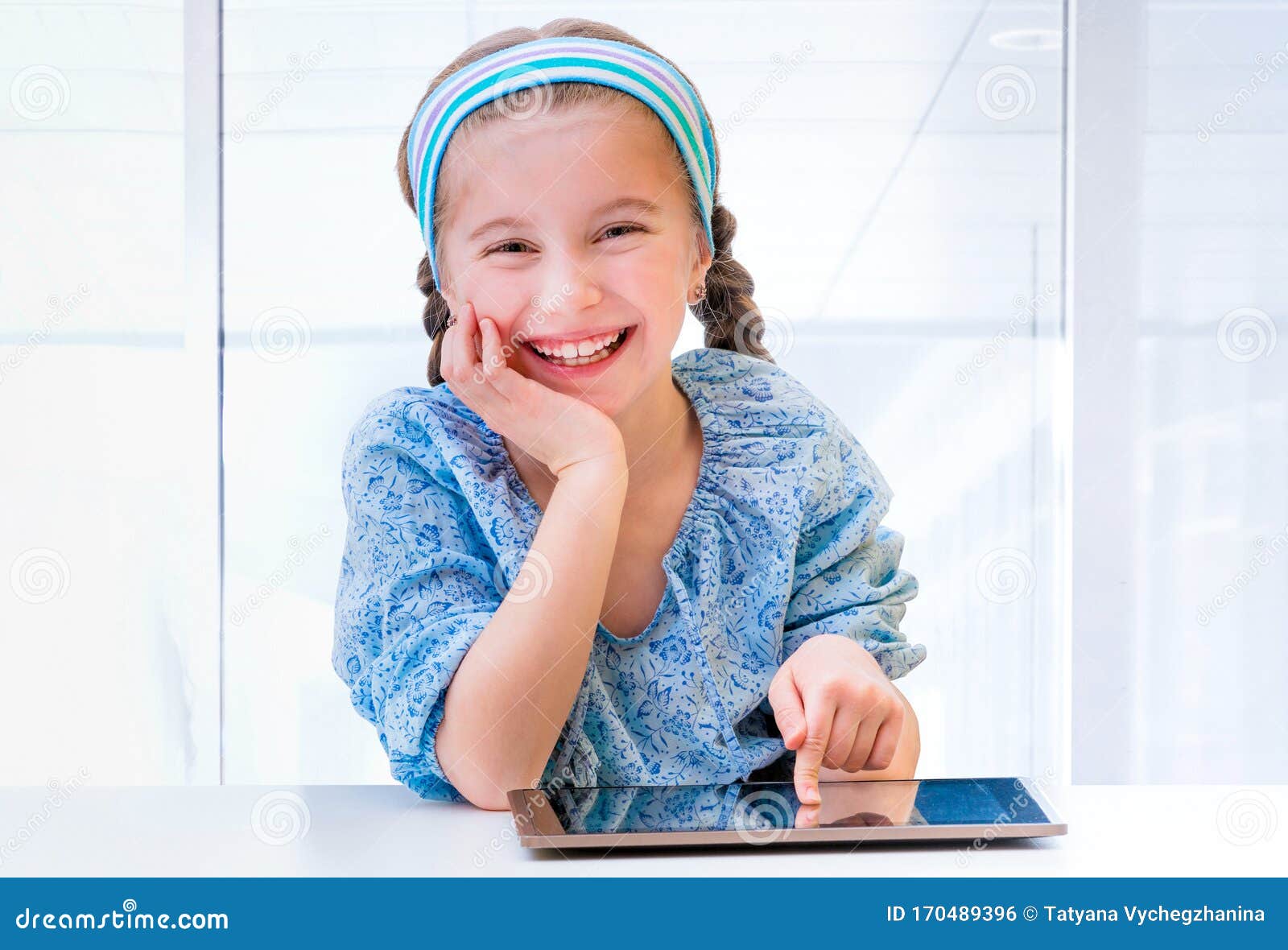Little Girl and Her Magic Tablet Stock Photo - Image of class, face ...