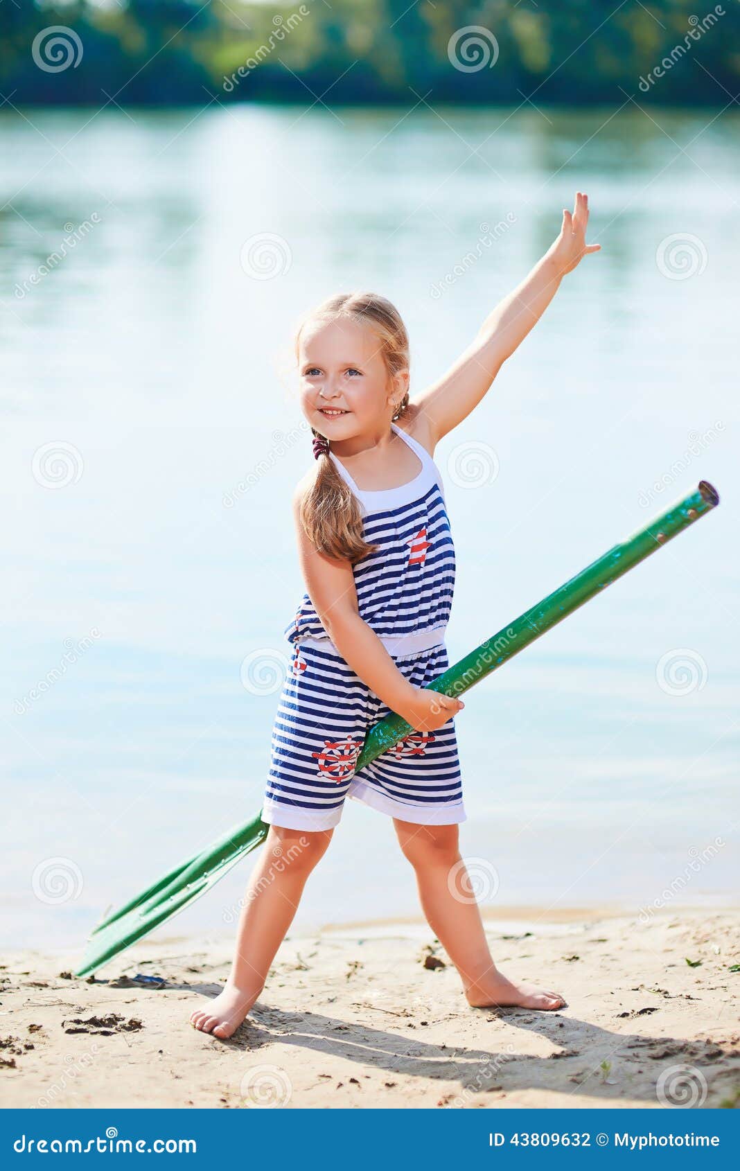 Happy Little Girl with Paddle at Beach Stock Photo - Image of cheerful ...