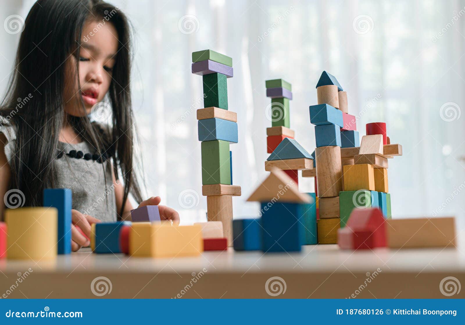 Happy Little Girl Playing Game Building Constructor Tower from ...