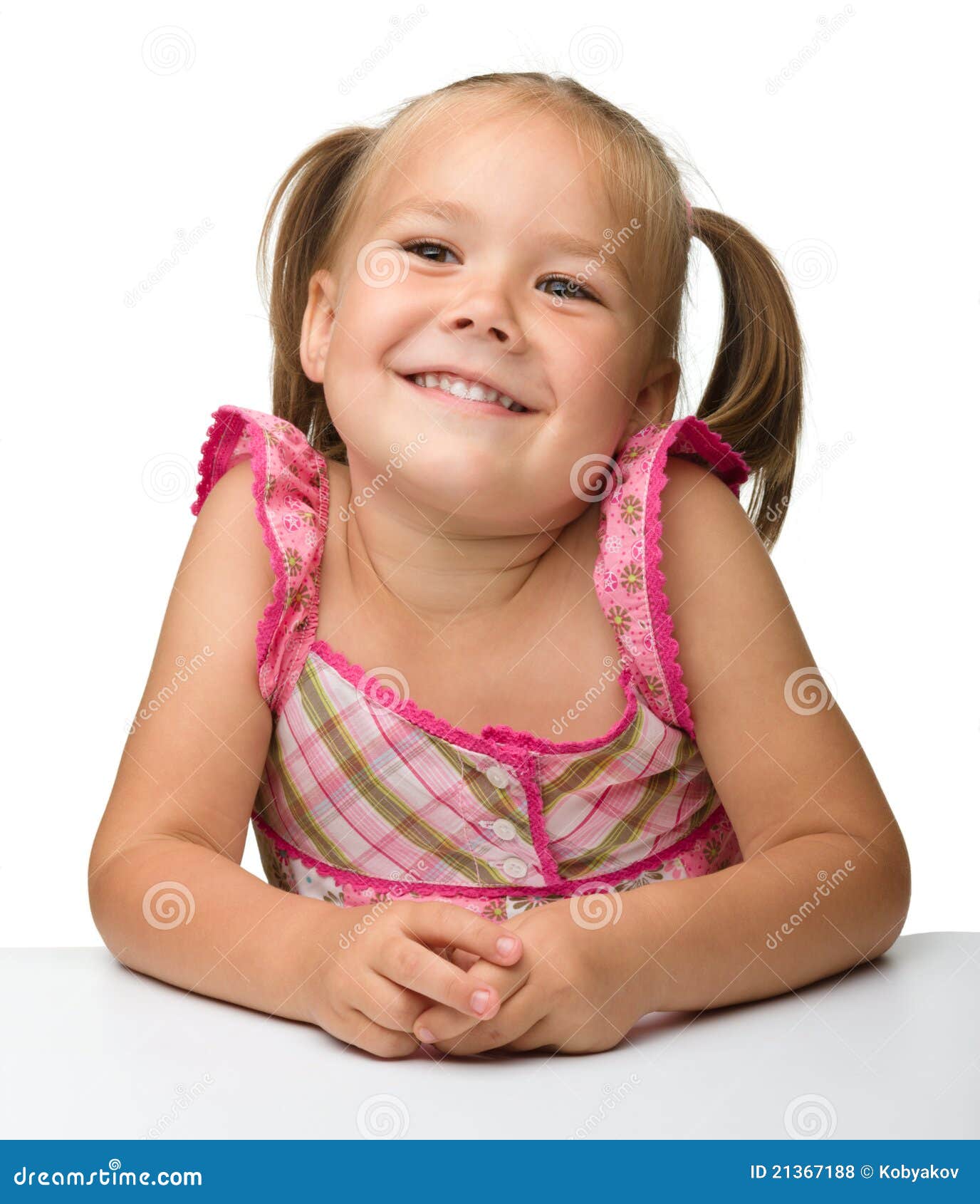 Happy Little Girl is Sitting at the Table Stock Photo - Image of person ...
