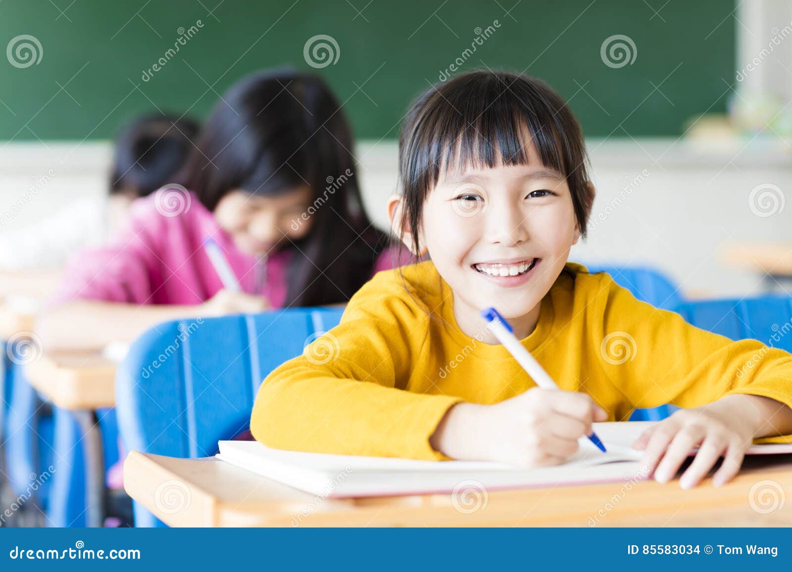 Happy Little Girl Student Studying in the Classroom Stock Photo - Image ...