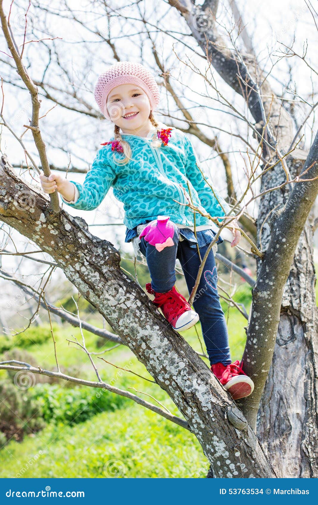 Happy Little Girl on a Tree Stock Photo - Image of carefree, baby: 53763534