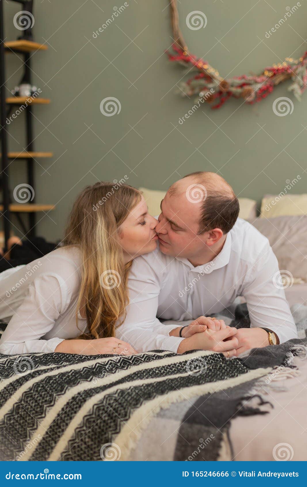 Happy Lovers on the Bed in a Beautiful Interior. Stock Photo - Image of ...