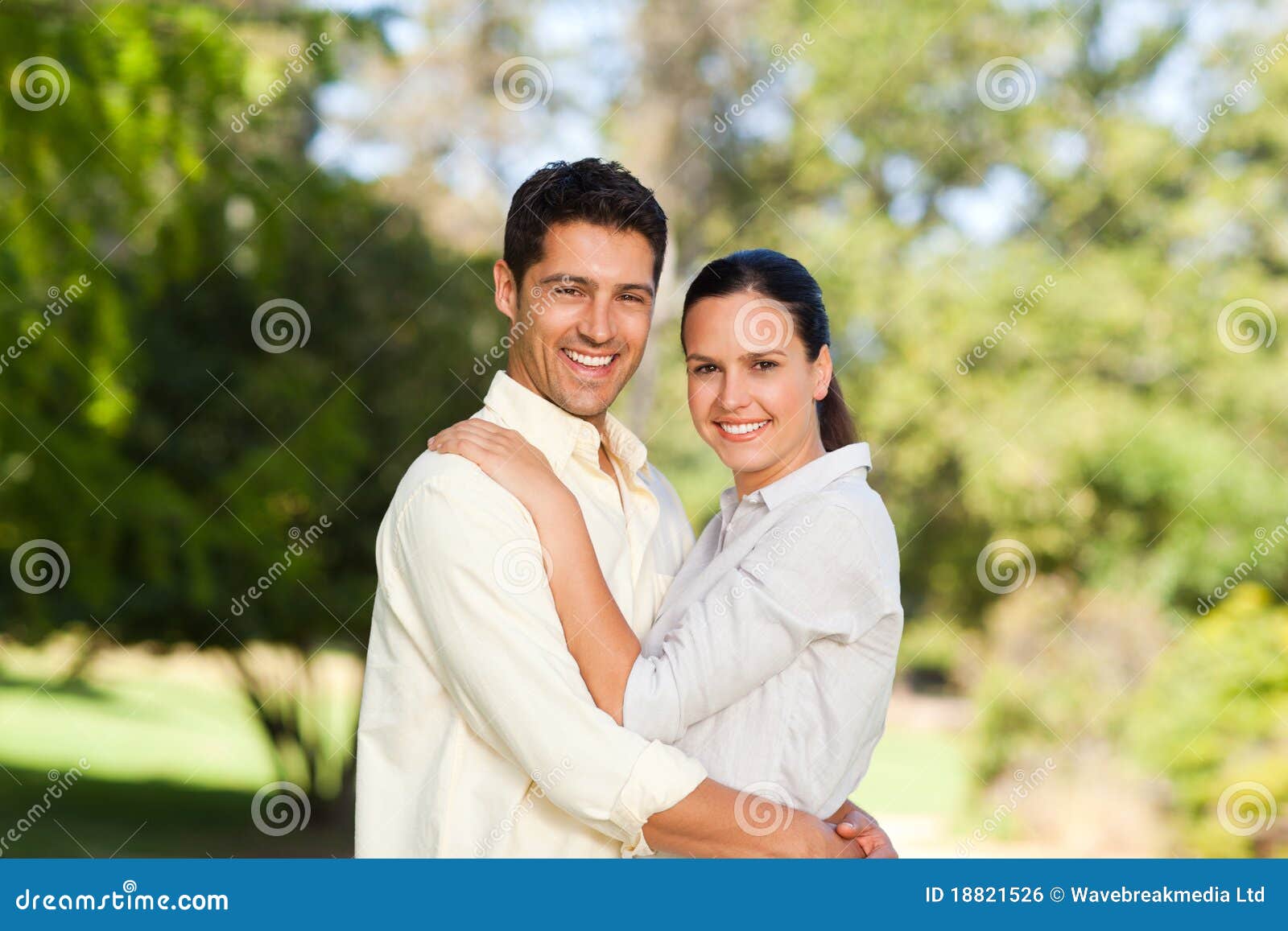 Happy lovers in the park stock photo. Image of person - 18821526