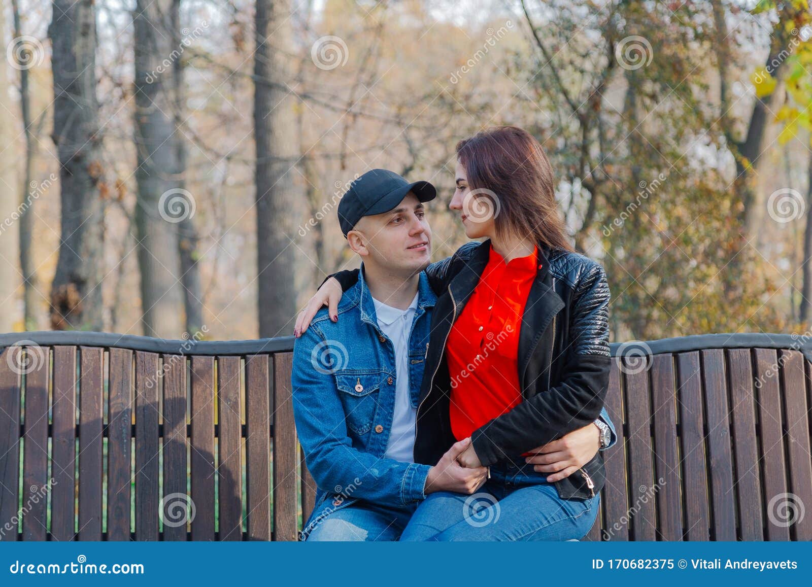 Happy Lovers in the Park on a Bench in Autumn. Stock Image - Image of ...