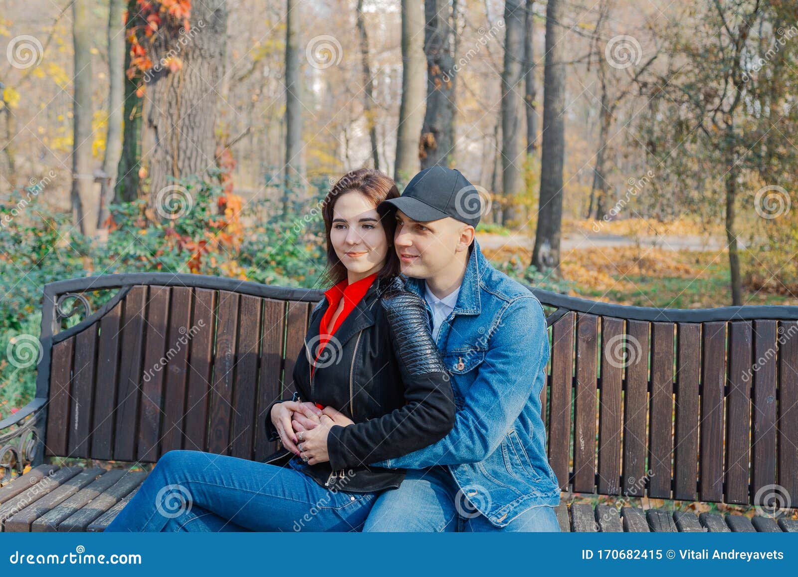 Happy Lovers in the Park on a Bench in Autumn. Stock Image - Image of ...