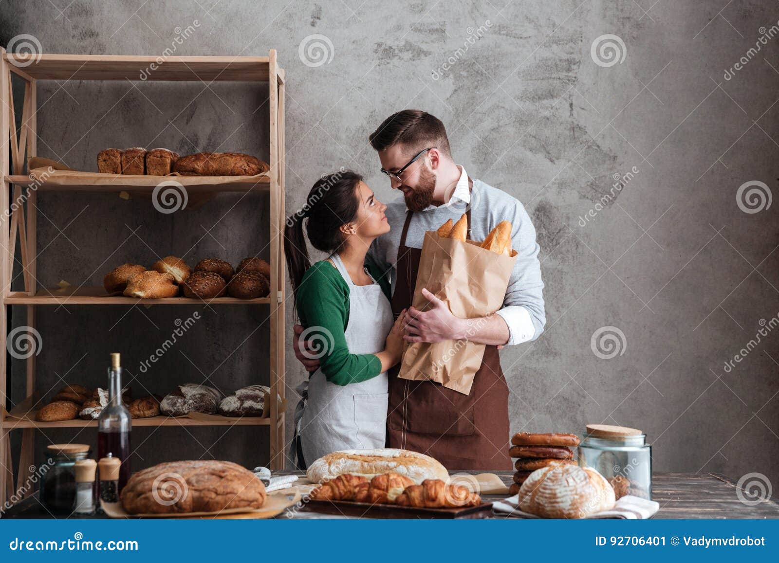Happy Loving Couple Bakers Holding Bread in Hands Stock Image - Image ...