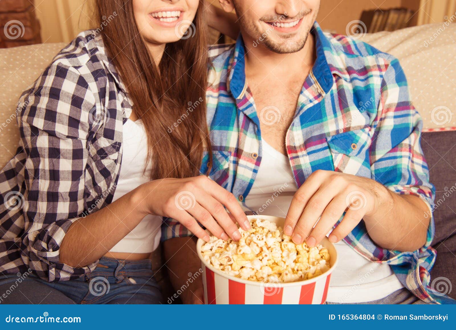 Happy Loving Couple Eating Popcorn on the Couch Stock Photo - Image of ...