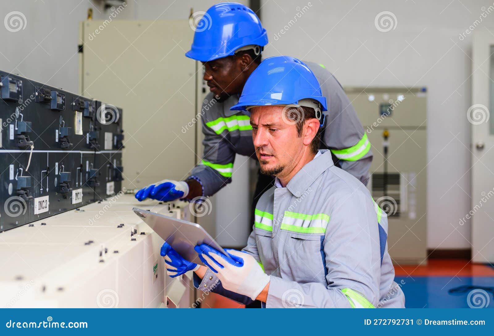 Happy Maintenance Engineer Checking and Maintaining Solar Panels System ...