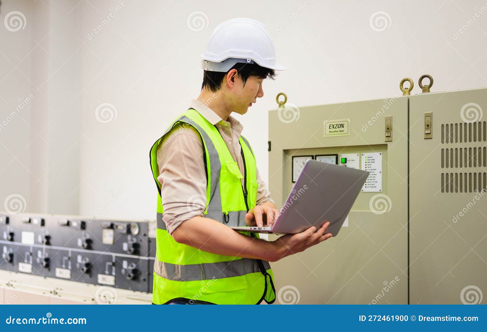 Happy Maintenance Engineer Checking and Maintaining Solar Panels System ...