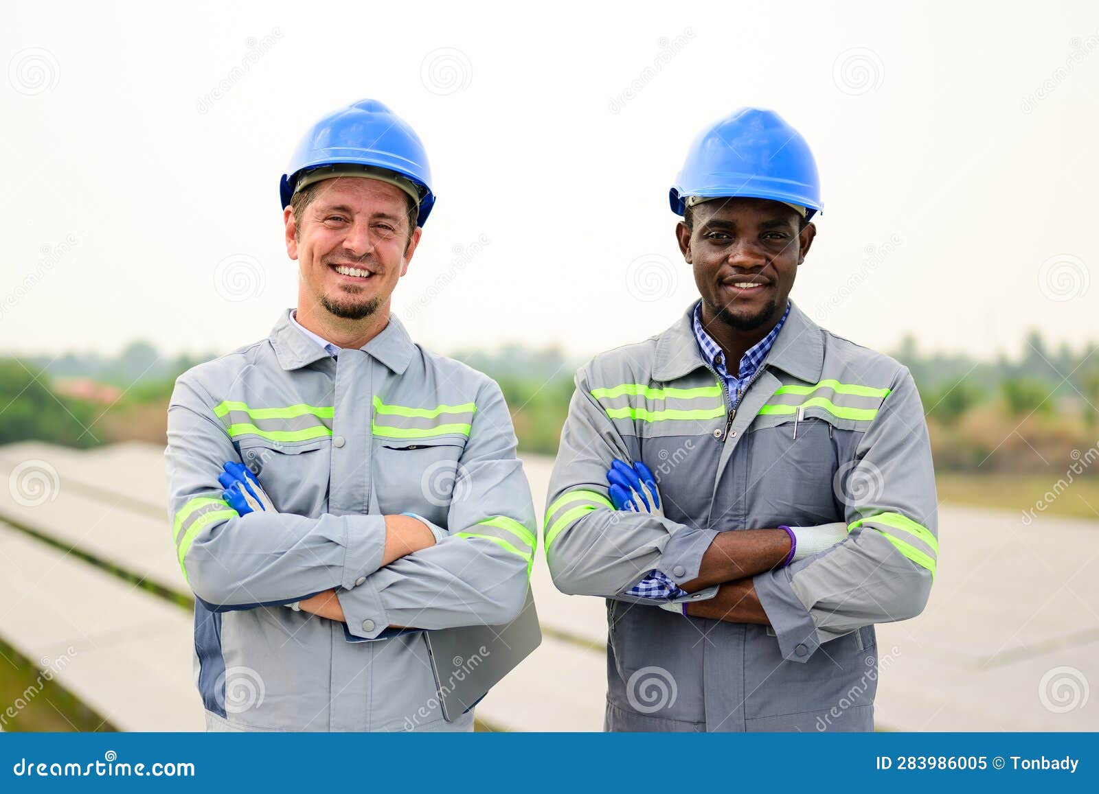 Happy Maintenance Engineers Checking and Maintaining Solar Panels Stock ...