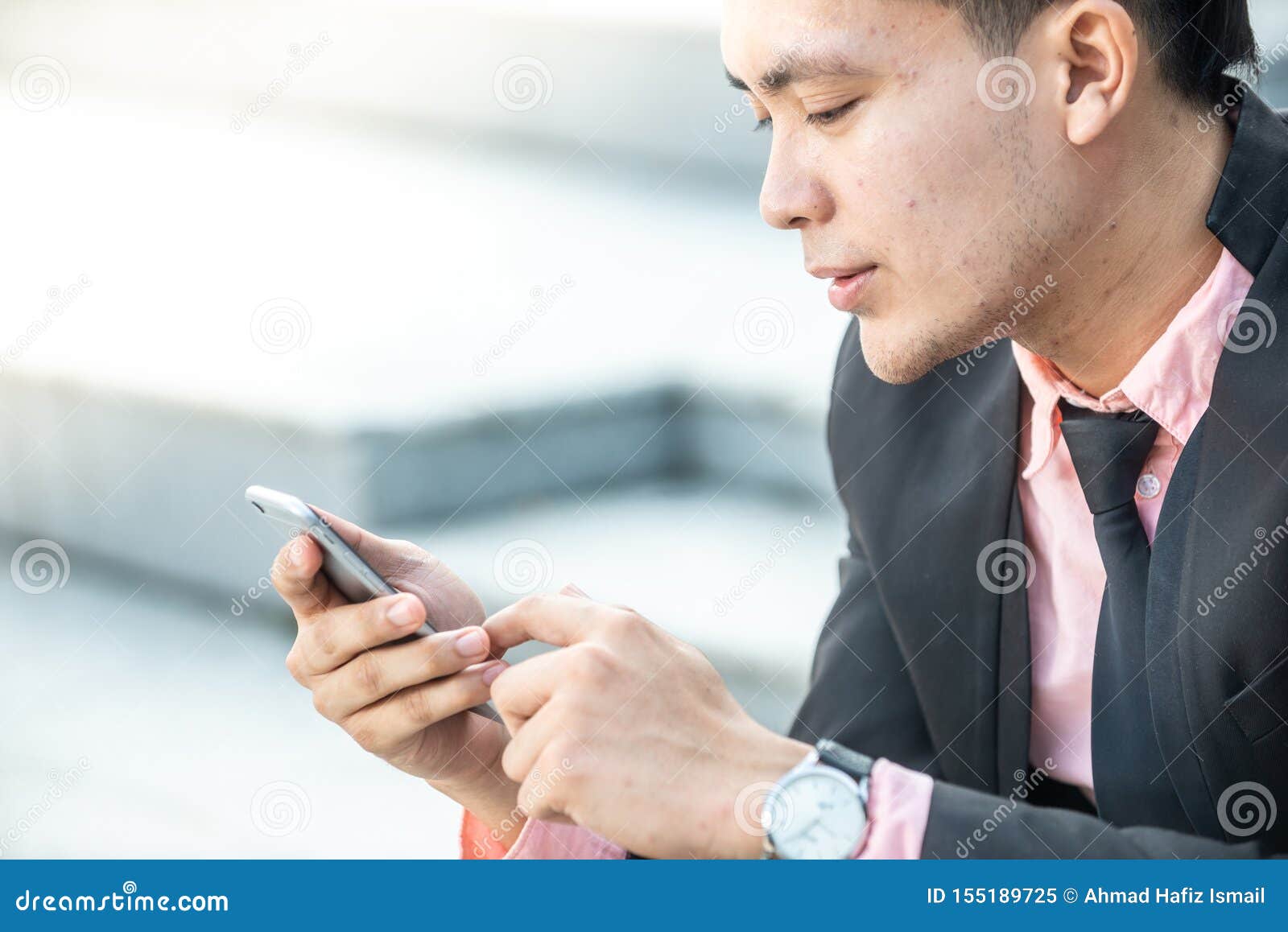 Happy Malay Businessman Looking at His Smartphone Stock Image - Image ...