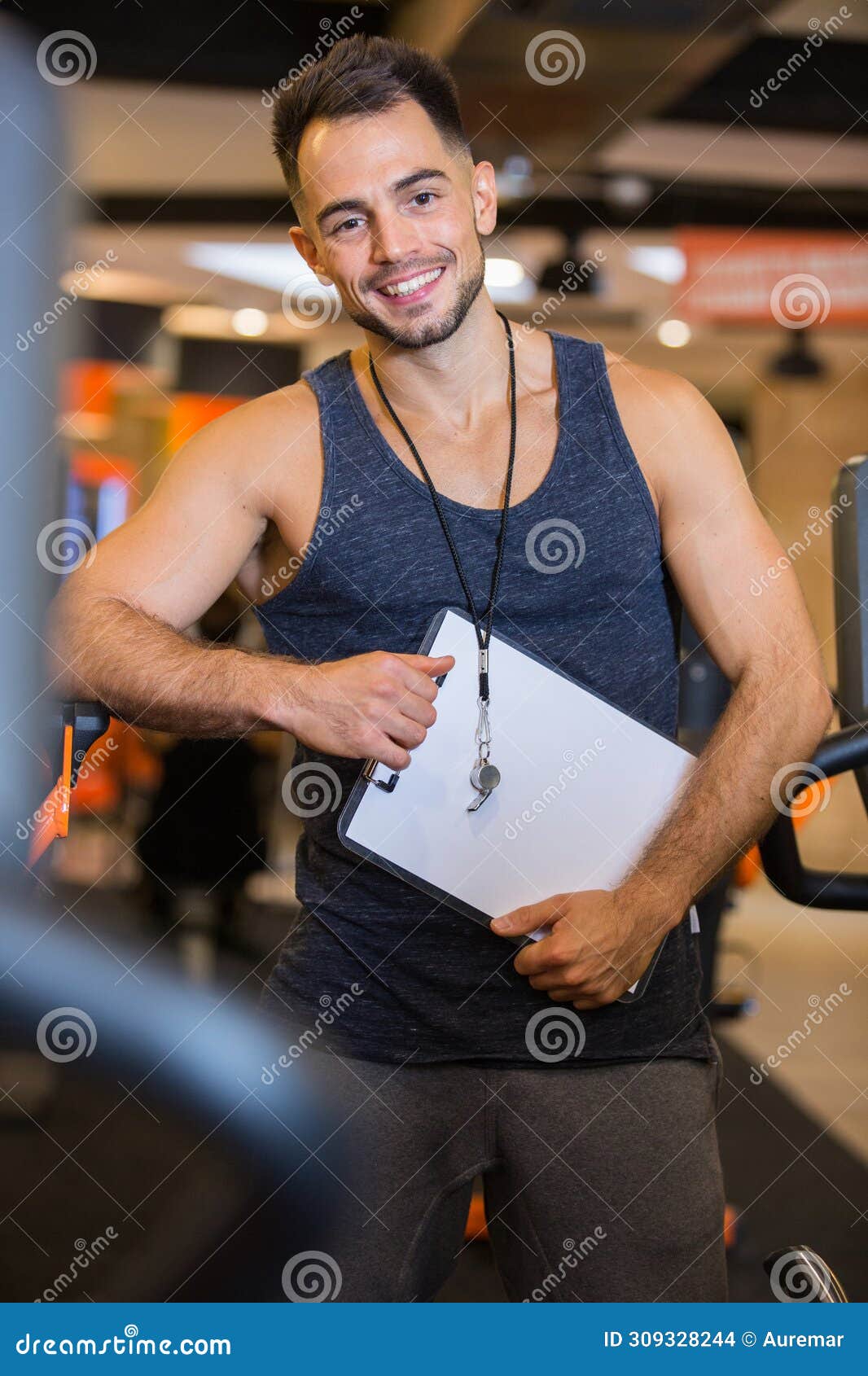 Happy Male Gym Instructor Looking at Camera Stock Photo - Image of ...