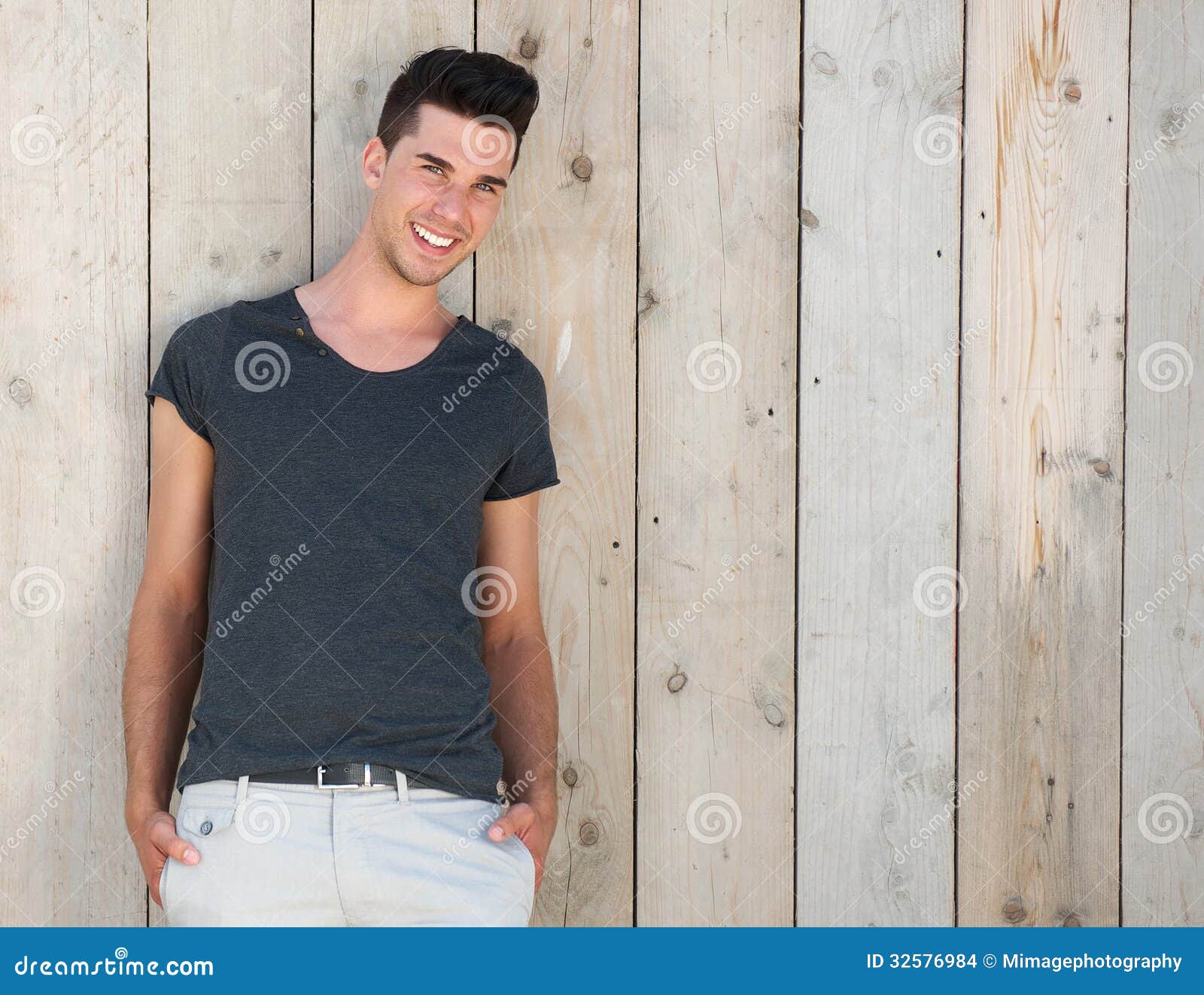 Happy Male Model Standing Outdoors and Smiling Stock Photo - Image of ...