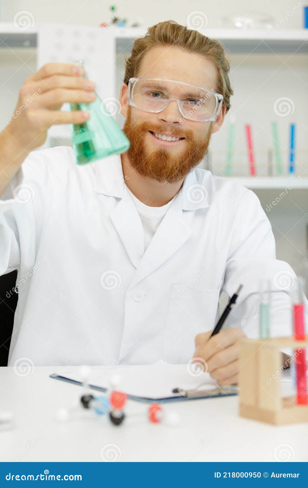 Happy male worker in lab stock photo. Image of sample - 218000950
