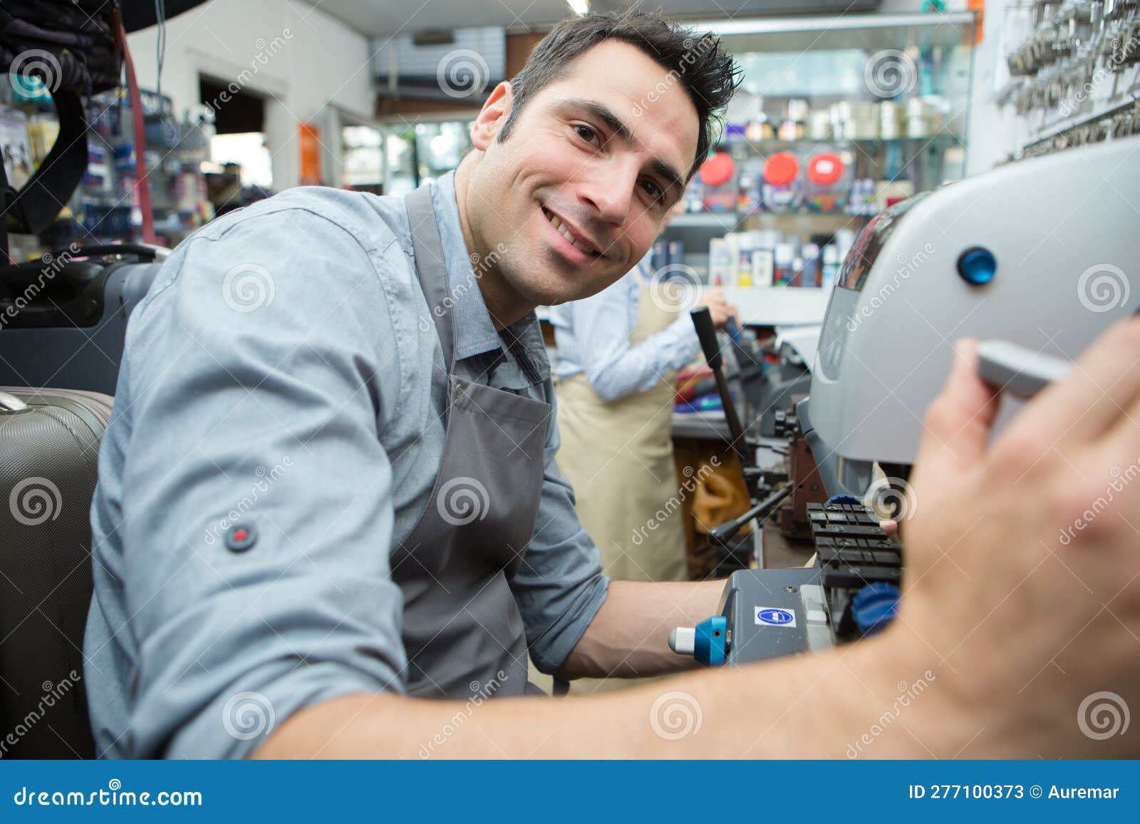 Happy Male Worker Making Keys in Workshop Stock Image - Image of ...