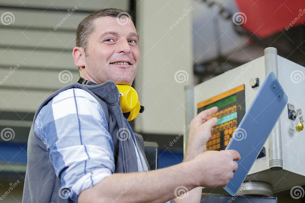 Happy Male Worker Operating Machine Stock Photo - Image of adult ...