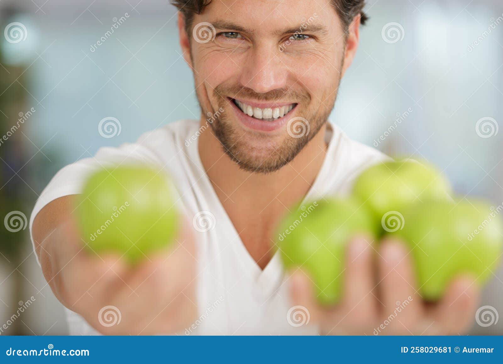Happy man with apples stock image. Image of nutrition - 258029681
