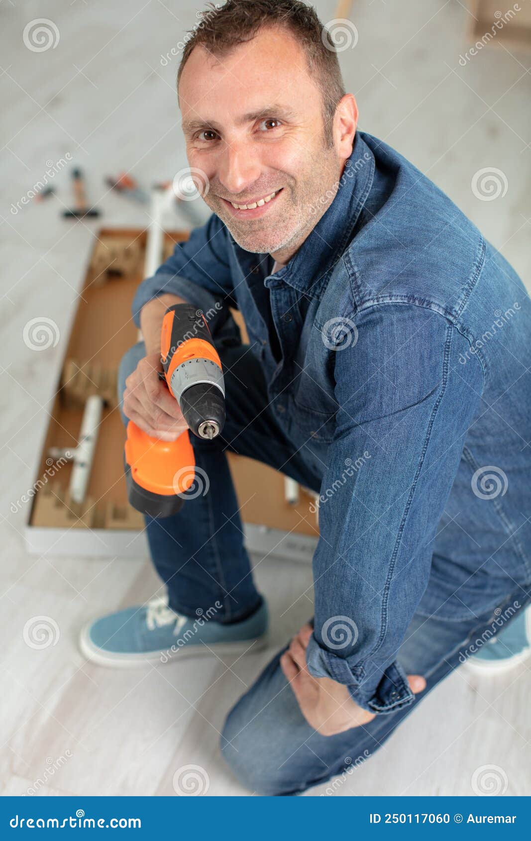 Happy Man Assembling in New Home Stock Photo - Image of industry ...